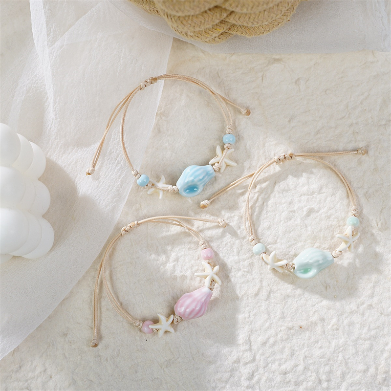 Vòng tay bện Ocean Talisman Thiết kế sao biển & ốc xà cừ - Di sản ven ...