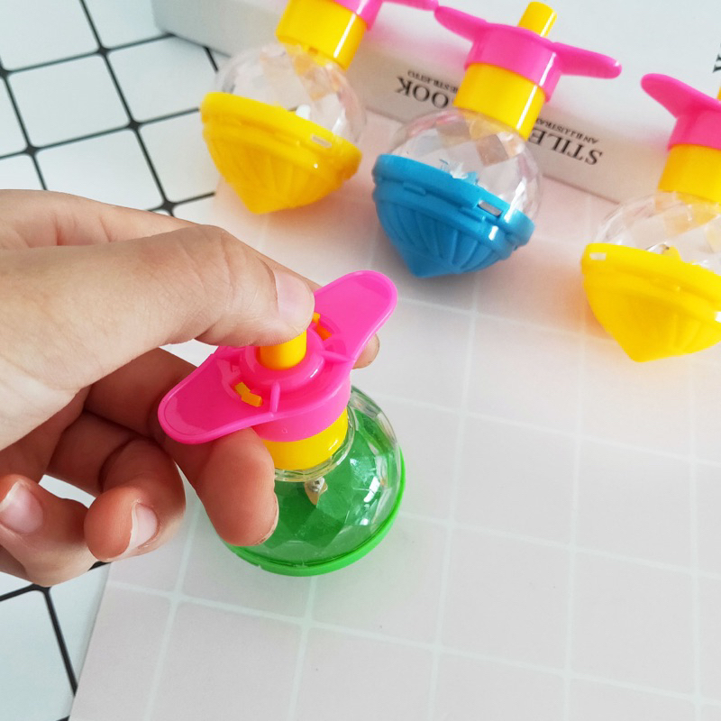 Con quay có đèn phát sáng cù quay cho bé | Shopee Việt Nam