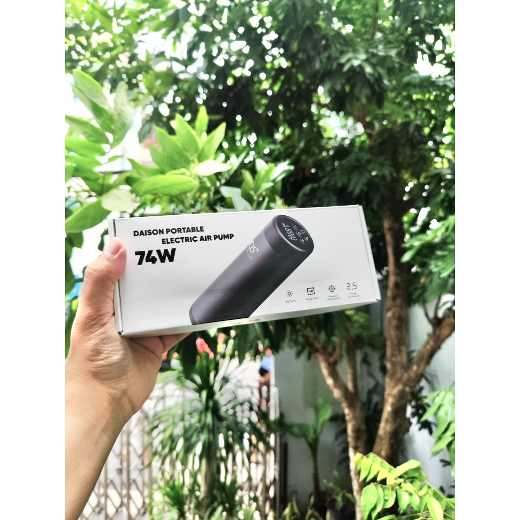 Máy bơm xe hơi , xe đạp , xe máy , ..loại cầm tay hiệu Daison Portable Electric Air Bump ...