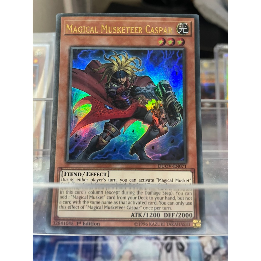 Thẻ bài Magical Musketeer Caspar - DUOV-EN071 - Ultra Rare 1st Edition ...