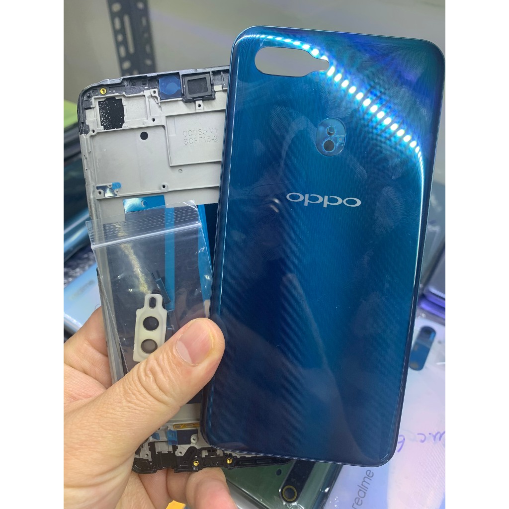 Bộ xương vỏ zin new Oppo A7 (nắp lưng, khung sườn màn hình, cụm kính camera, nút nguồn, nút ...