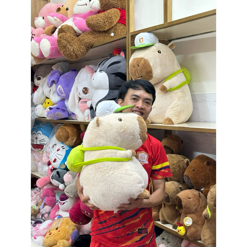Gấu bông capybara, capybara màu hồng, capybara đeo túi, capybara nước ...