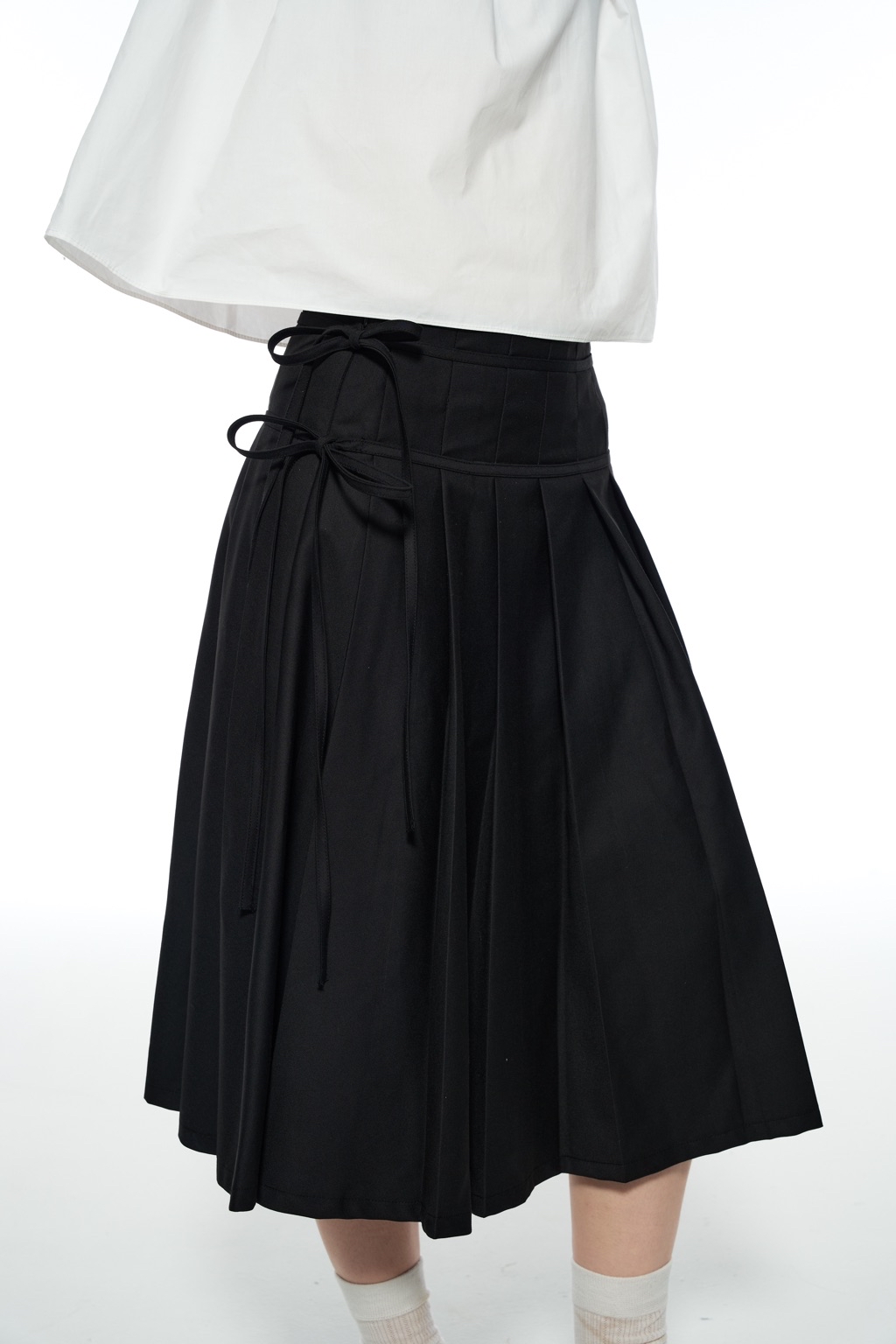 LOLLIE STUDIO - Chân váy midi xếp li pleated đính nơ hông nổi YUNA ...